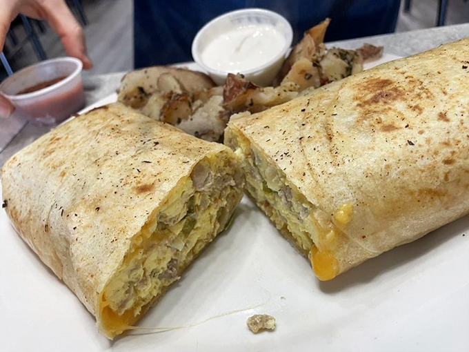 Breakfast burrito cross-section reveals the architectural genius inside&mdash;eggs and cheese in perfect harmony, ready to fuel your day.