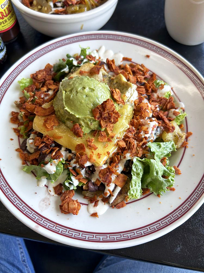 Breakfast rebellion at its finest! This burrito bowl throws convention out the window while inviting avocado and coconut bacon to the morning party.