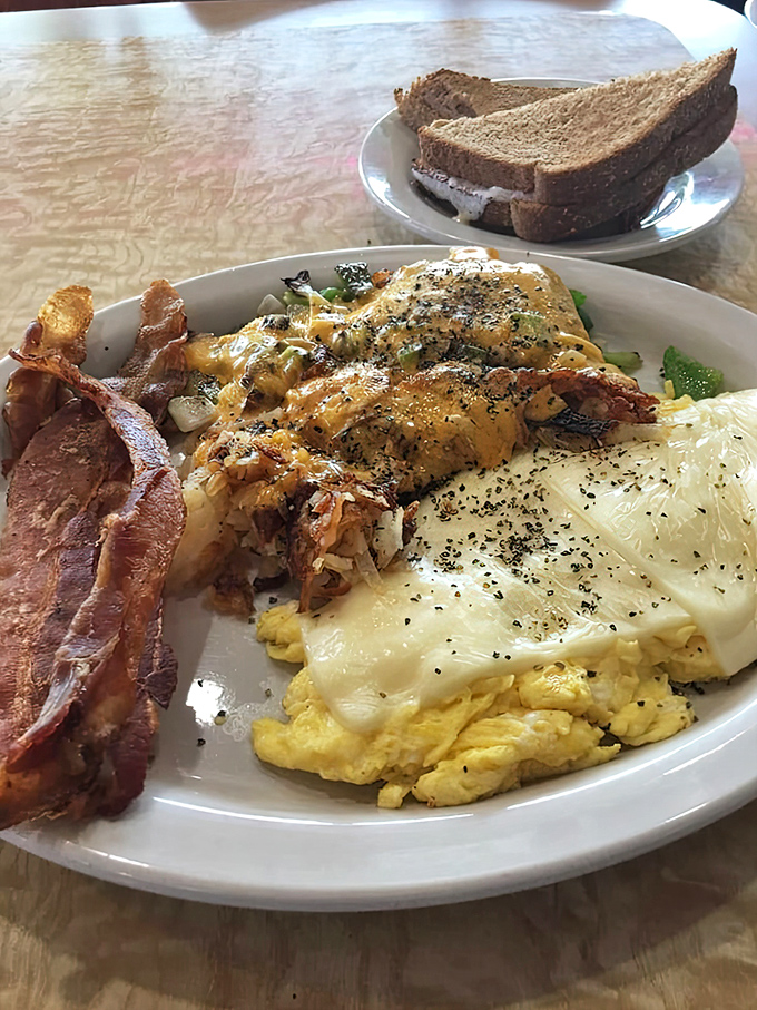 Behold: the breakfast platter that says, "You won't need lunch today," with eggs, bacon, and toast standing ready for your morning conquest.