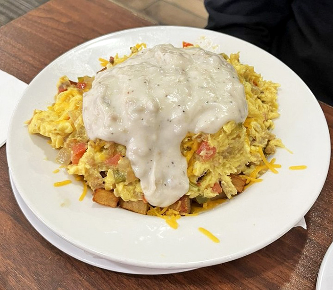 A breakfast scramble that looks like it was created by someone who understands that gravy isn't just a condiment&mdash;it's a lifestyle choice.