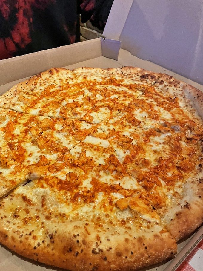 The Buffalo Chicken pizza proves that two comfort foods can merge into one glorious creation that makes you question why you'd ever order them separately.
