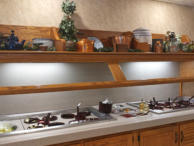 The salad bar battlefield where restraint goes to die. "Just a little more" becomes your mantra as you navigate this treasure trove.