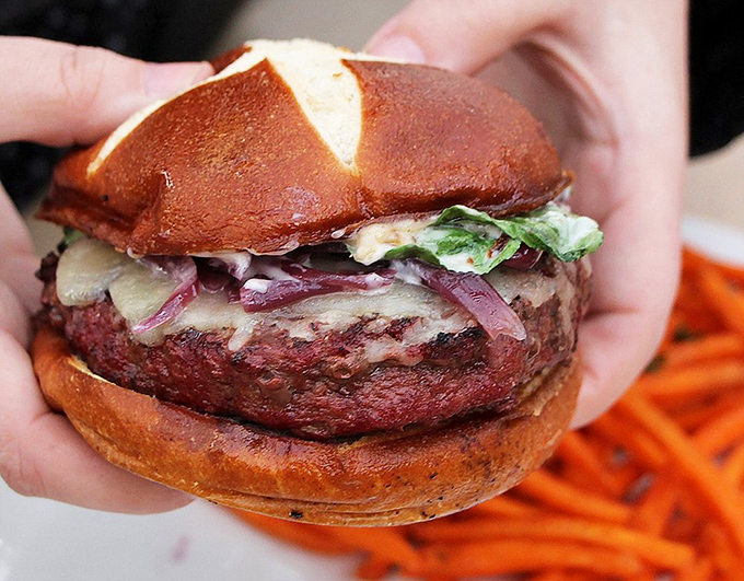 This isn't just a burger; it's a masterpiece on a pretzel bun that makes fast food versions look like they need to go back to hamburger school.