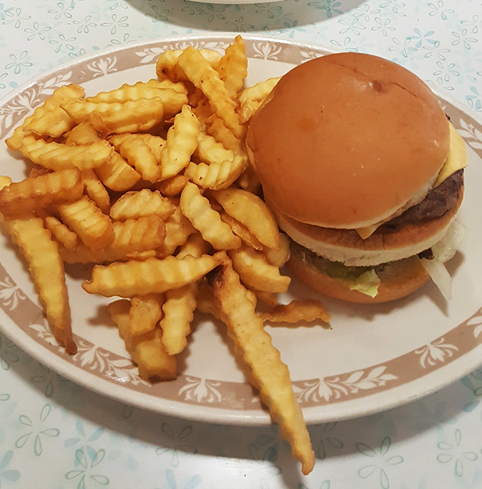 A classic diner burger with crinkle-cut fries&mdash;proof that simplicity, when done right, beats culinary gymnastics every time.