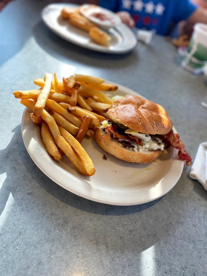 This isn't just a burger&mdash;it's a hand-held masterpiece of beef and bun, with fries so golden they'd make Fort Knox jealous.