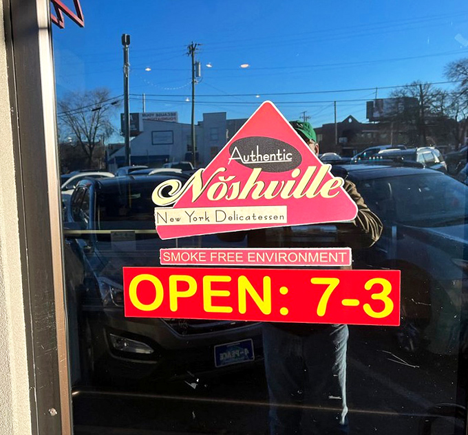 Simple signage announcing hours that welcome early birds and those seeking late afternoon comfort alike.