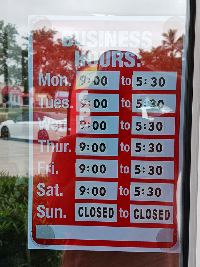 Business hours posted clearly&mdash;because knowing when to hunt for treasures is the first step in a successful thrifting expedition.