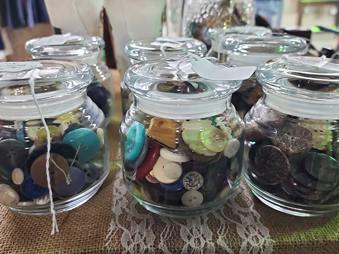 Button, button, who sorted the buttons? These glass jars contain tiny fashion history &ndash; each button once fastened someone's Sunday best or everyday workwear.