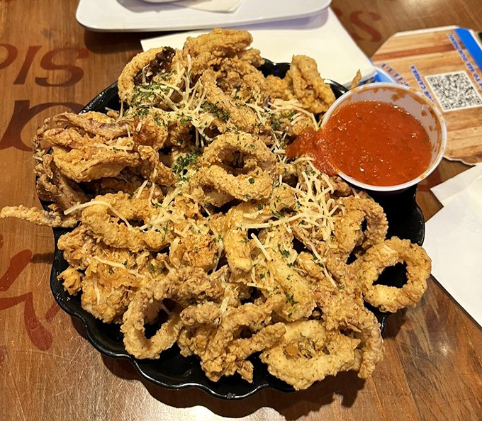 Calamari that defies the rubbery reputation of lesser versions, dusted with parmesan and served with a sauce worth bottling and taking home.