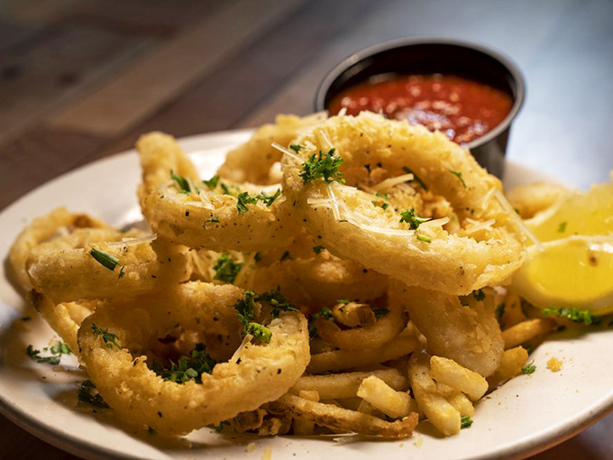 Calamari rings so perfectly golden and crisp, they deserve their own Olympic medal category. The marinara is just showing off.