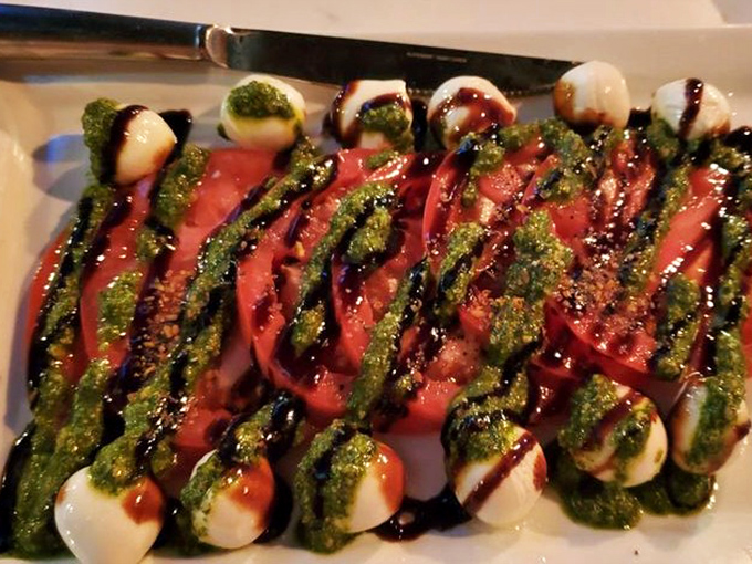 Fresh mozzarella, tomatoes, and pesto drizzled with balsamic &ndash; a caprese that offers a moment of lightness before returning to burger nirvana.