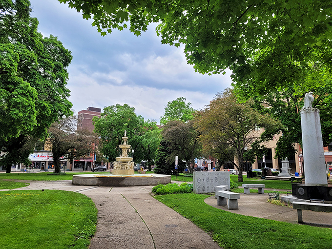 This tranquil park oasis offers a moment of green serenity amid the urban landscape &ndash; nature's gentle counterpoint to the city's industrial rhythm.