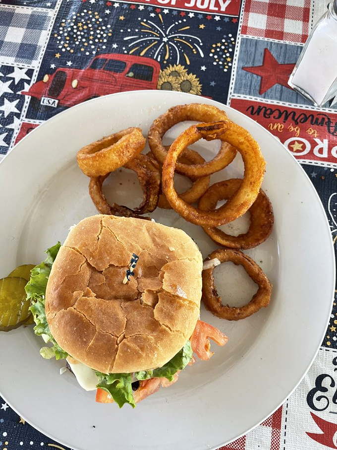 A cheeseburger deluxe with onion rings that makes every bite feel like a small celebration.