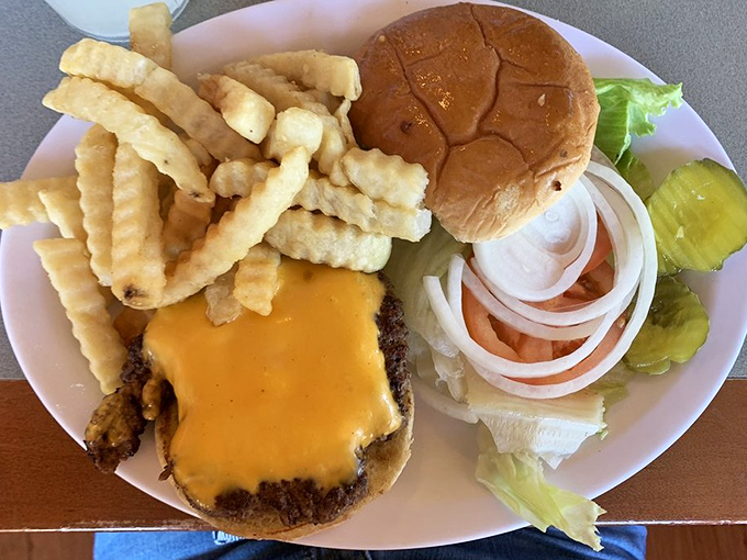 This isn't just a cheeseburger&mdash;it's a testament to simplicity done right, with crinkle-cut fries standing at attention alongside.