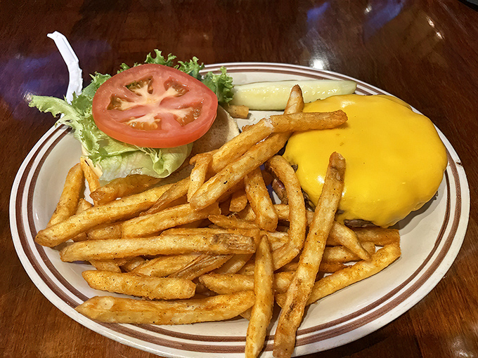 A cheeseburger that doesn't need gimmicks&mdash;just perfectly melted American cheese, crisp fries, and the satisfaction of simple things done right.