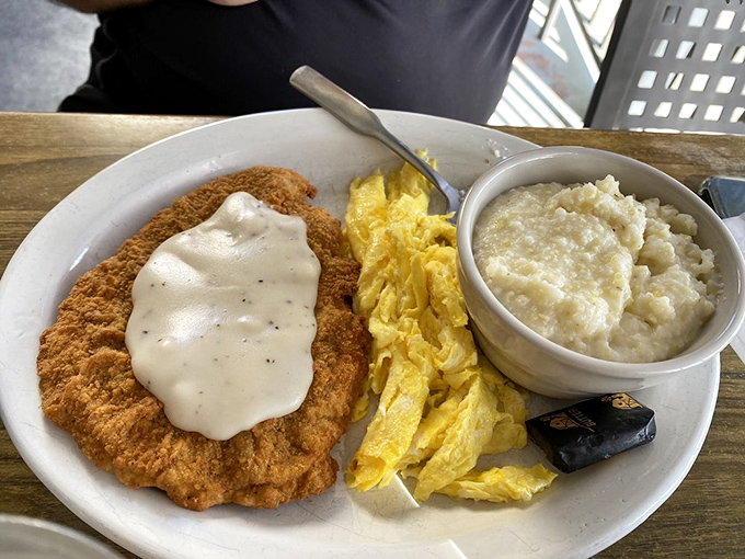 Chicken fried steak that arrives like a golden, crispy monument to Southern culinary genius.