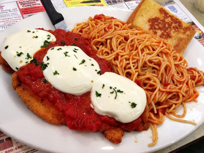 Chicken Parmesan that would make any Italian grandmother nod in approval. That melted cheese pulls like it's auditioning for a food commercial. 