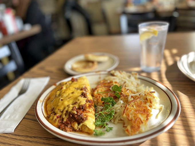This omelet doesn't just satisfy hunger&mdash;it negotiates peace treaties with it, while the hash browns stand by as delicious, crispy witnesses.