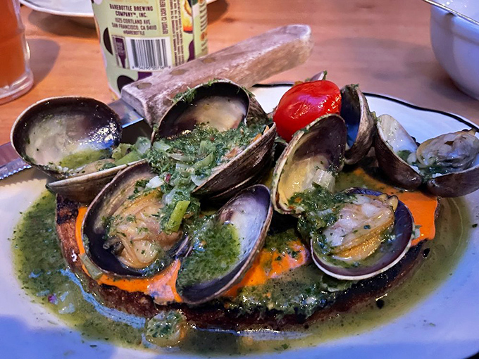 Fresh clams swimming in herb-infused broth deliver ocean flavors straight to your table.