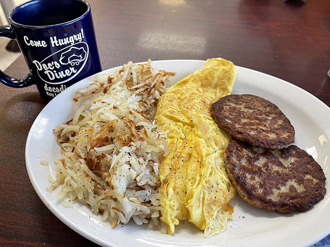 The classic breakfast plate showcases perfectly cooked eggs alongside golden hash browns, creating morning perfection on ceramic canvas.