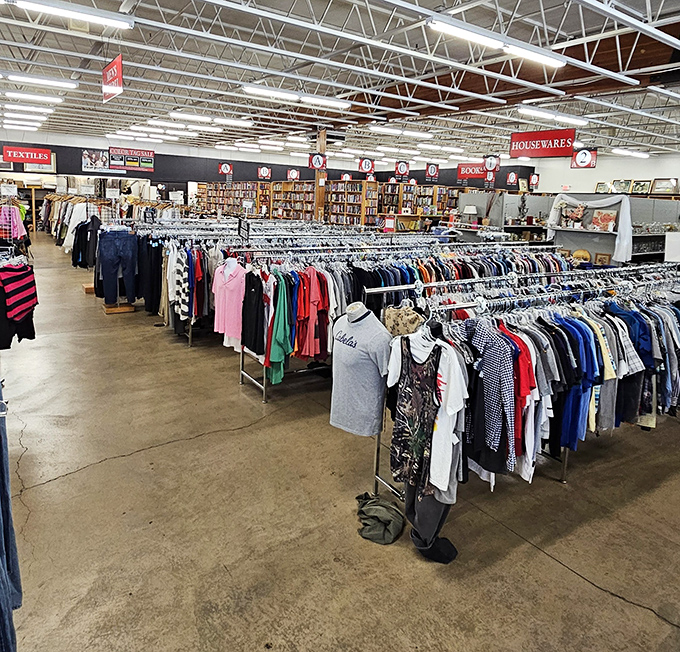 A panoramic view of organized chaos that somehow makes perfect sense. The clothing section transitions seamlessly into books and housewares.