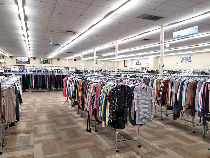 The clothing section stretches toward the horizon like a textile sea—racks upon racks of fashion waiting for their second act in someone's closet.