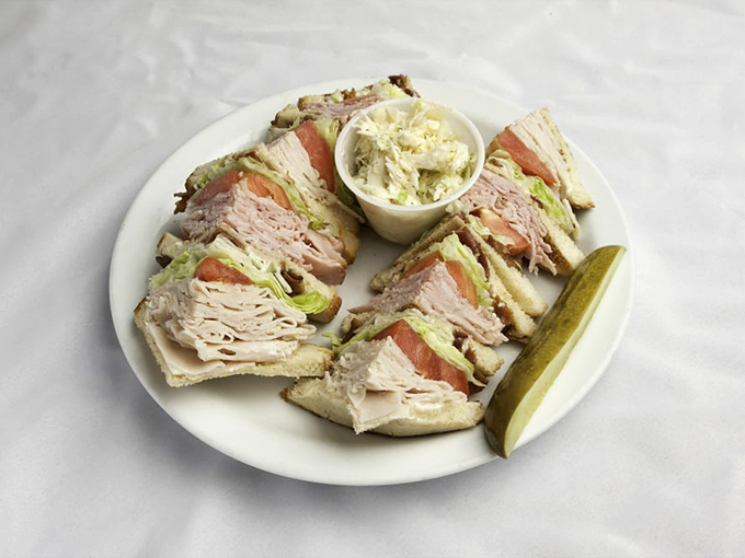 The club sandwich&mdash;America's boardroom lunch transformed into a triple-decker masterpiece with the ideal meat-to-veg ratio and a side of nostalgia.