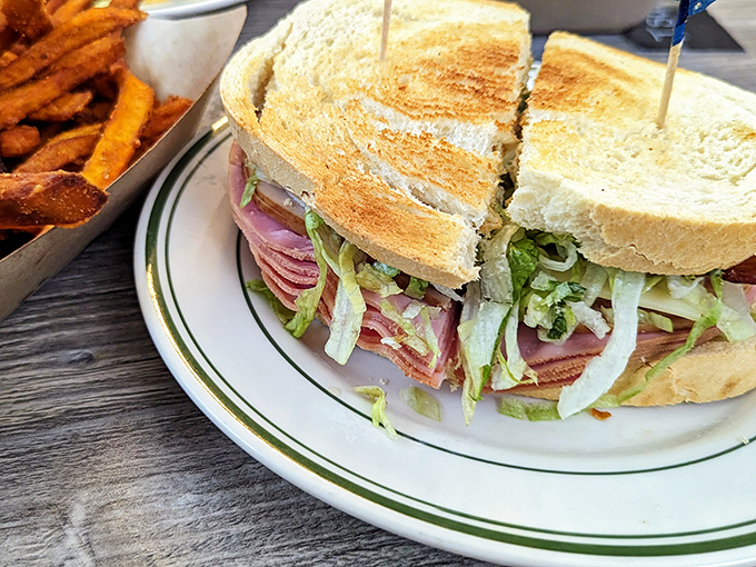 This club sandwich isn't just stacked&mdash;it's architecturally sound, with layers of freshness that would make any lunch enthusiast weak at the knees.