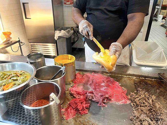 The sacred ritual of cheese application &ndash; that crucial moment when sandwich construction becomes sandwich art. Pure culinary theater.
