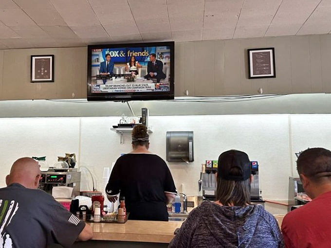 The breakfast counter ballet&mdash;customers perched on stools watching the news while staff orchestrate the morning rush with practiced precision.