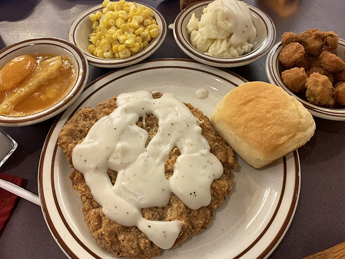 Country fried steak swimming in cream gravy &ndash; proof that sometimes the most beautiful things in life aren't meant to be photographed, just devoured.