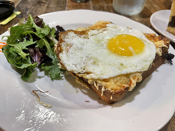 Breakfast perfection: a sunny-side-up egg crowning a toasty sandwich. The kind of simple pleasure that makes Monday feel like Saturday.