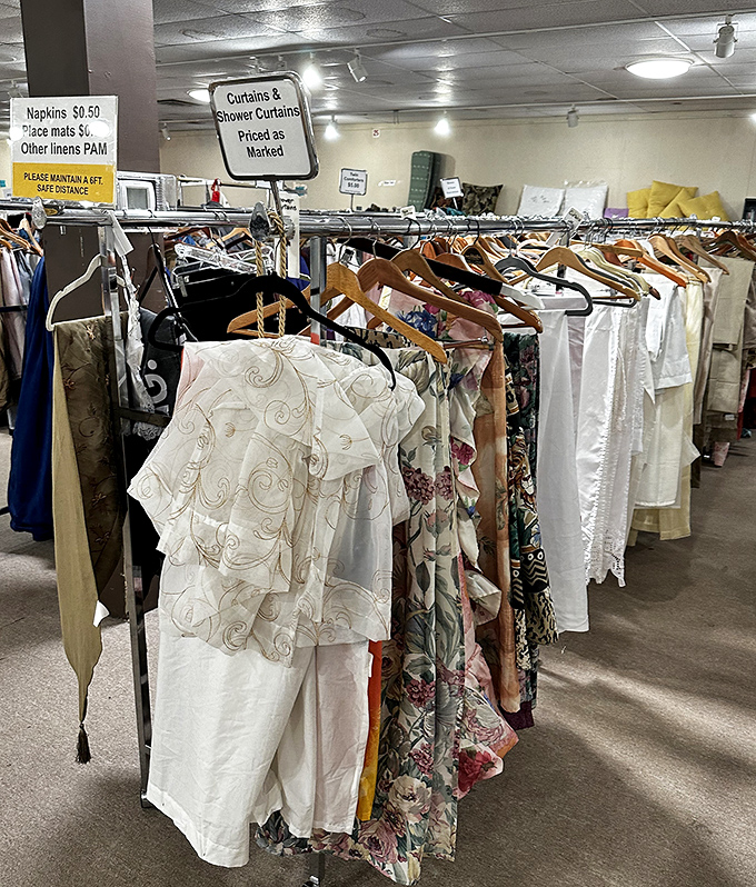 Curtains and linens organized like a home decorator's dream, where window treatments won't require window shopping budgets.