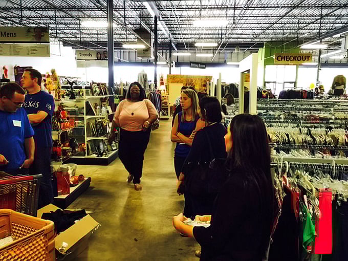 The social aspect of thrifting in action &ndash; strangers united by the universal language of "Can you believe someone got rid of this?"