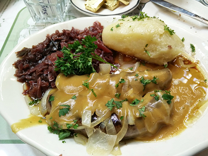 Traditional red cabbage alongside a perfectly tender pork cutlet smothered in gravy&mdash;European comfort food that makes you wonder why you don't eat this way more often.