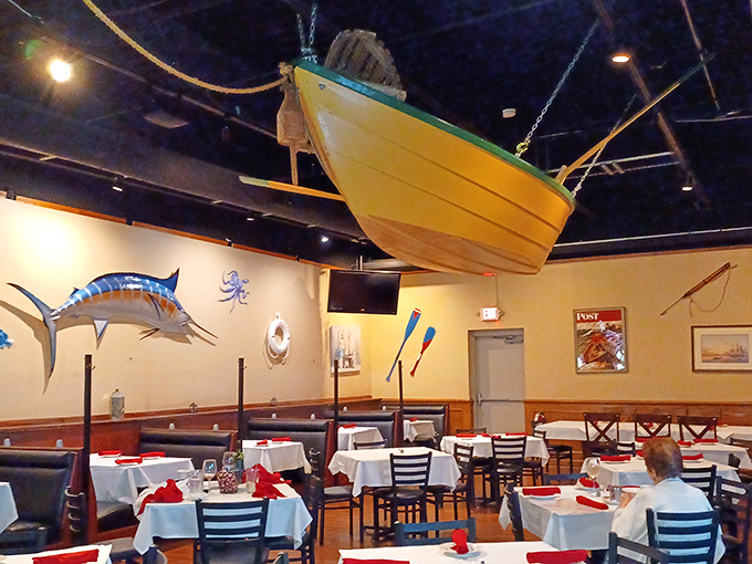 A yellow boat suspended from the ceiling&mdash;because nothing says "serious seafood restaurant" like dining beneath a vessel that never touches water.