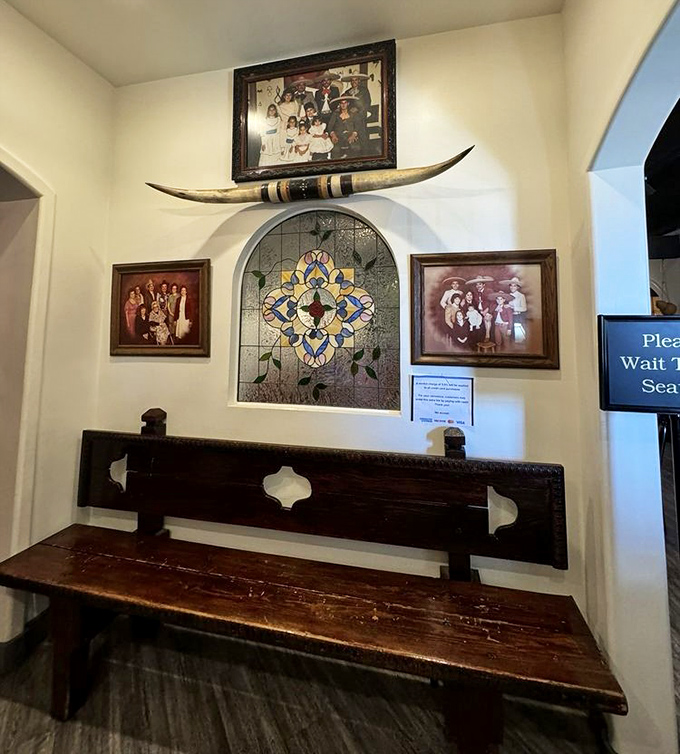 Family photos and decorative tiles create walls that tell stories, making every visit feel like dining in someone's beloved home.