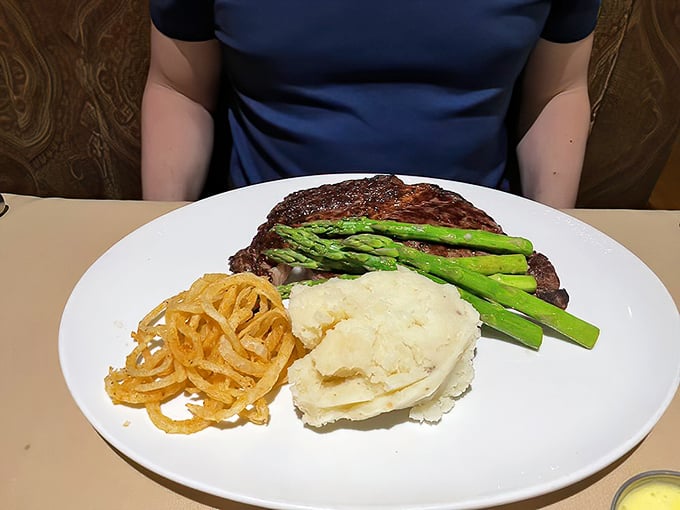 A ribeye that could make a vegetarian weep, accompanied by sides that know their supporting role but still deserve a standing ovation.