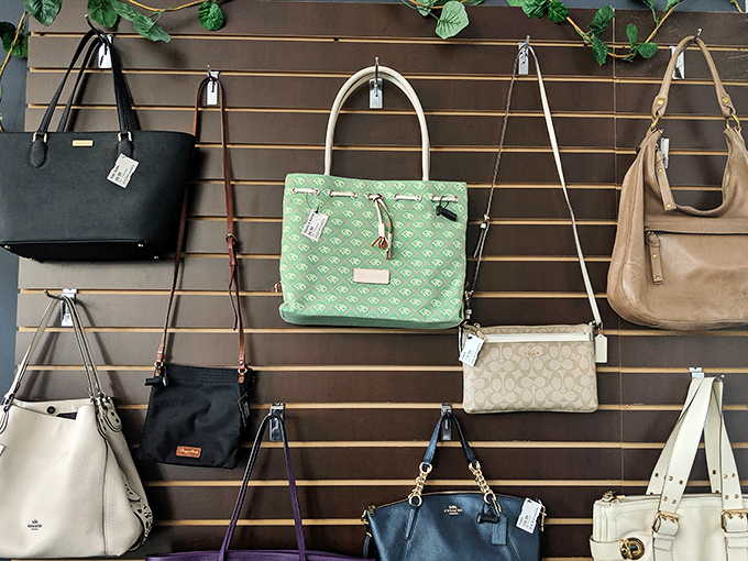 Designer handbags hang like ripe fruit, waiting to be plucked by savvy shoppers who know luxury doesn't require a loan.