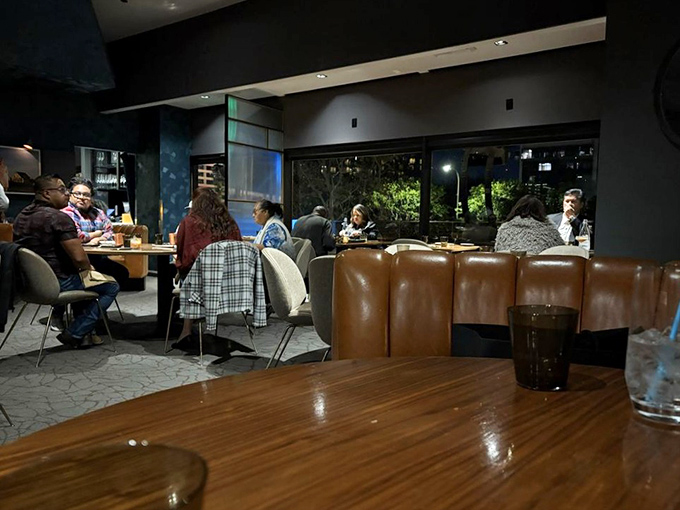 Conversations flow as freely as the wine in a space designed for both intimate whispers and celebratory proclamations.