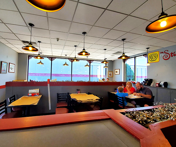 Families finding joy in shared sweetness. That focused silence? It's the universal language of "this is too good to waste time talking."