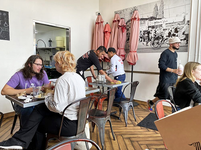 Inside Millie's, strangers become temporary breakfast companions, united by the universal language of "pass the hot sauce."