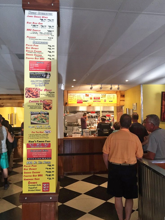 The menu board with its siren call of smoked delights draws a crowd of pilgrims on the path to pulled pork enlightenment.
