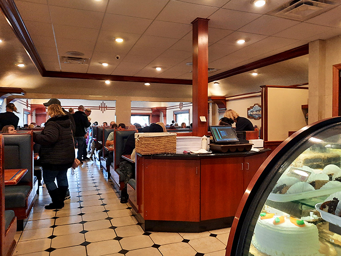 Busy dining room filled with happy customers tells the real story of this beloved neighborhood gem.