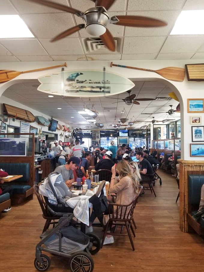 Morning magic happens here, where locals and visitors alike gather under surfboards to share stories and impossibly good breakfast creations.