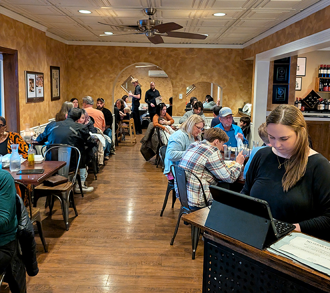 Where servers navigate the dining room like pasta professionals. The bustling atmosphere proves good Italian food will always draw a crowd.