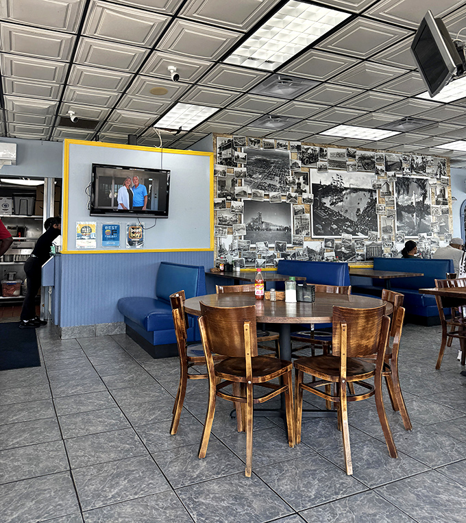 Where modern meets nostalgia &ndash; flat-screen TVs hang near vintage photographs, much like how traditional dishes meet modern tastes.