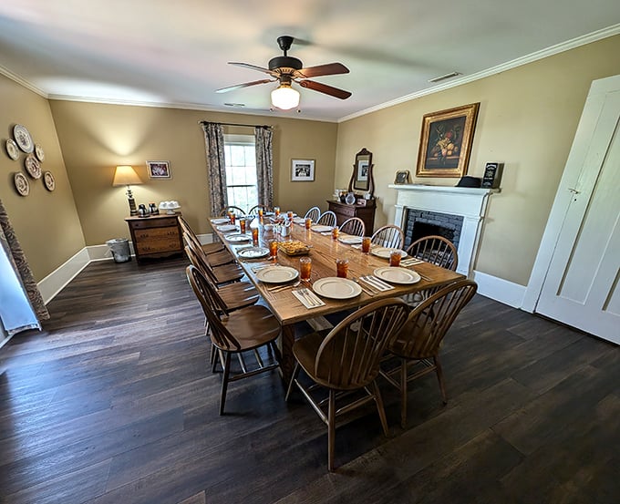 A dining room where time slows down and conversations flow as freely as the sweet tea. The fireplace has witnessed countless proposals.