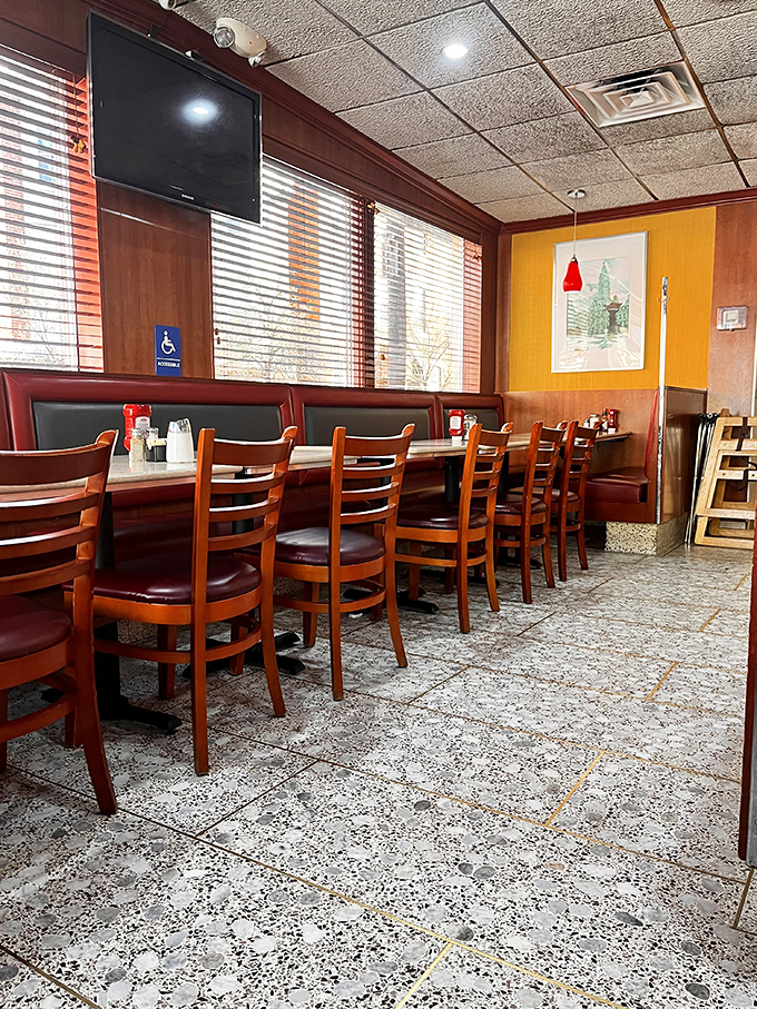 Wooden chairs and red booths create the perfect setting for solving the world's problems over endless coffee refills.