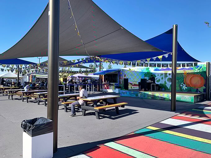 The swap meet's dining area offers a colorful respite for weary shoppers. Take a load off, refuel, and strategize your next bargain-hunting move.